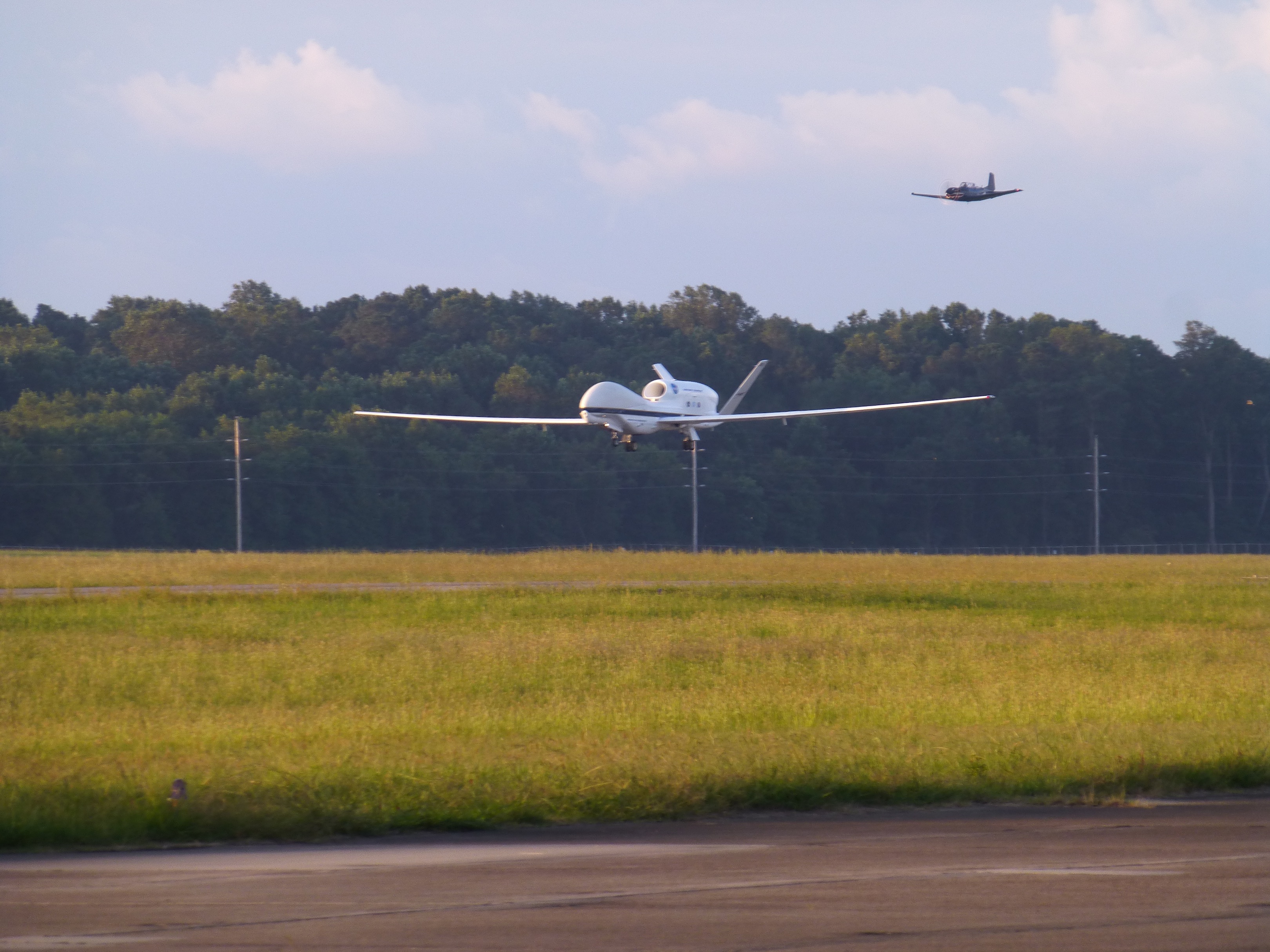 Global Hawk accompanied by chase aircraft | NASA Airborne Science Program